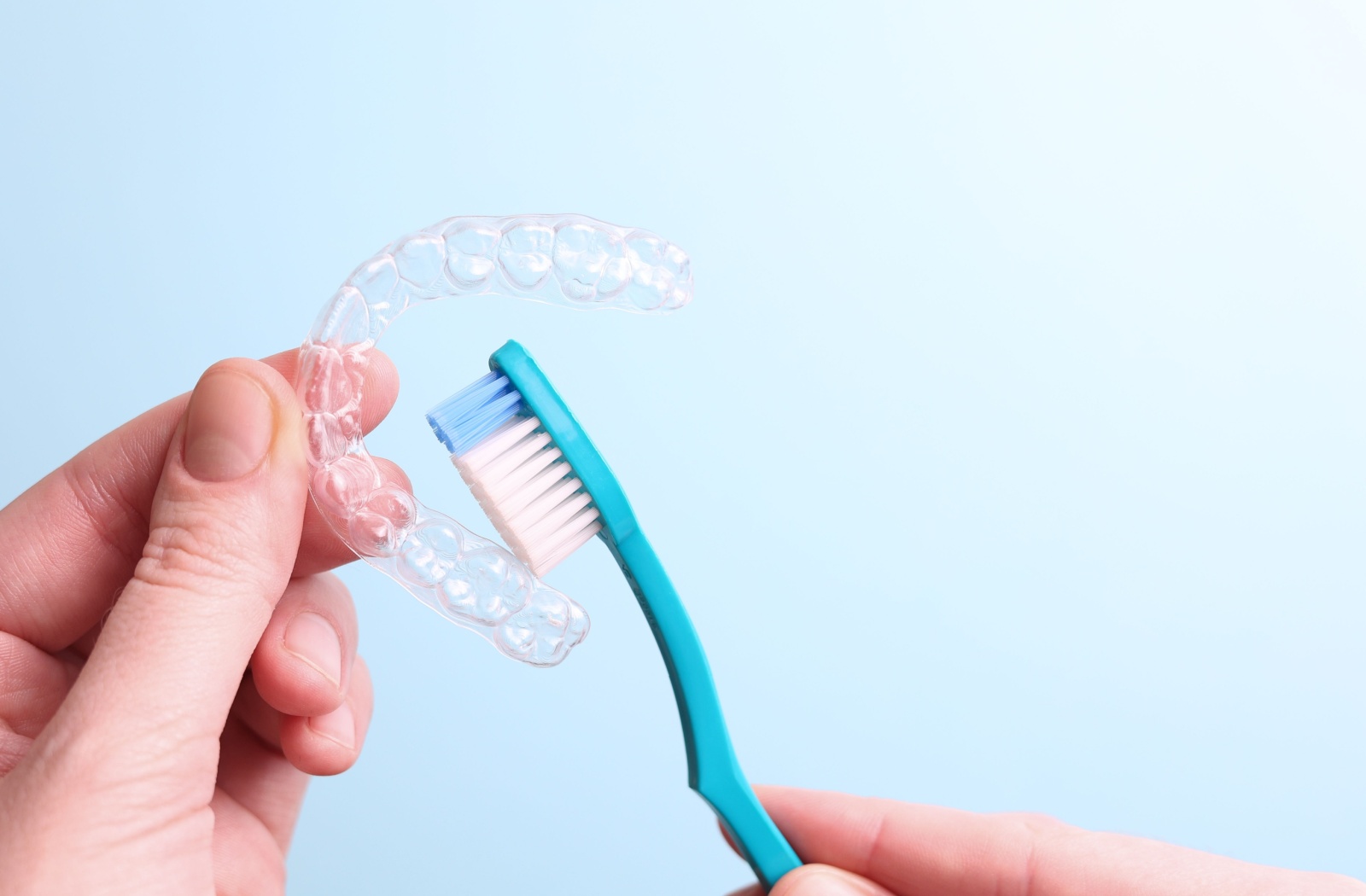 How to Properly Clean Invisalign | Cooper Dental | Calgary